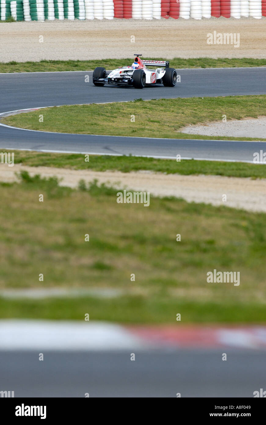 Formula 1 racing car on a track with curves Stock Photo - Alamy