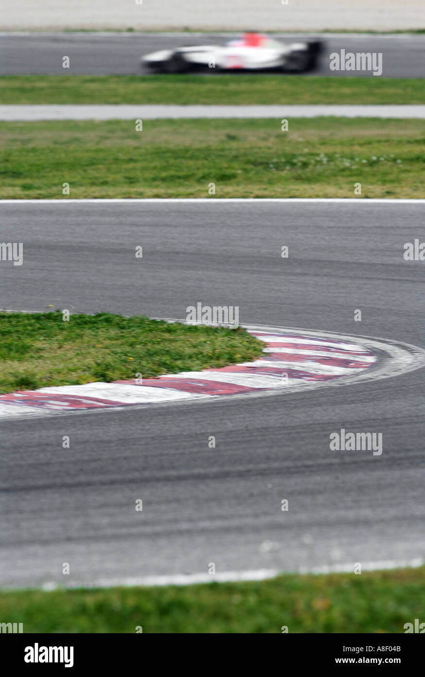 Formula 1 racing car on a track with curves Stock Photo - Alamy