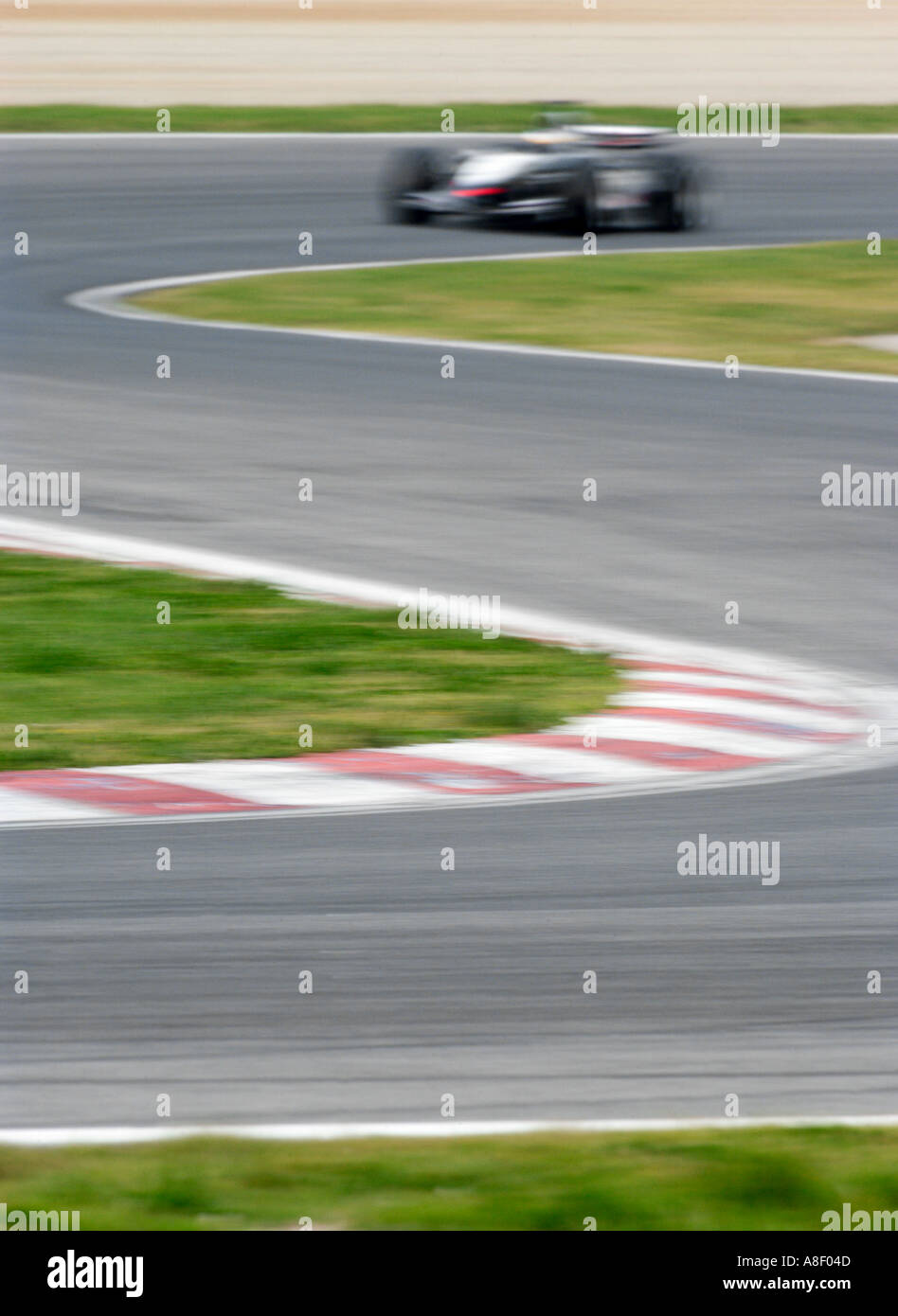 Formula 1 racing car on a track with curves Stock Photo - Alamy