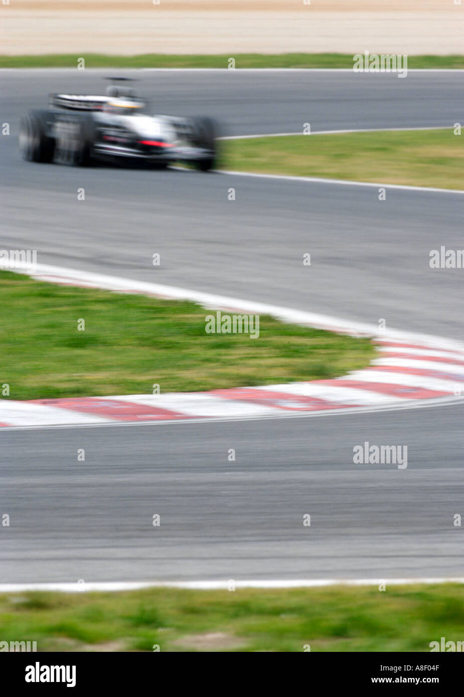 Formula 1 racing car on a track with curves Stock Photo - Alamy
