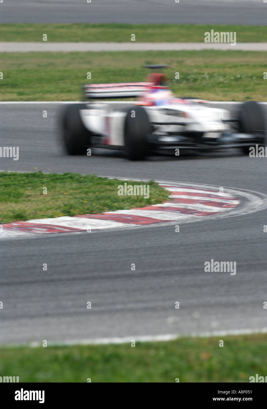 Formula 1 racing car on a track with curves Stock Photo - Alamy