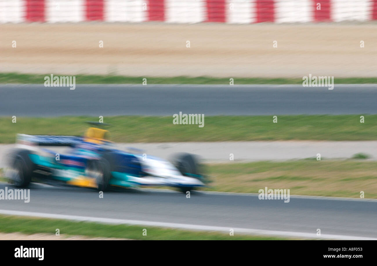 Formula 1 racing car on a track with curves Stock Photo - Alamy