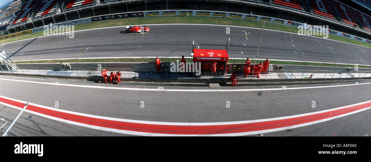 Panoramic view of the racing track and pit lane with mechanics at ...