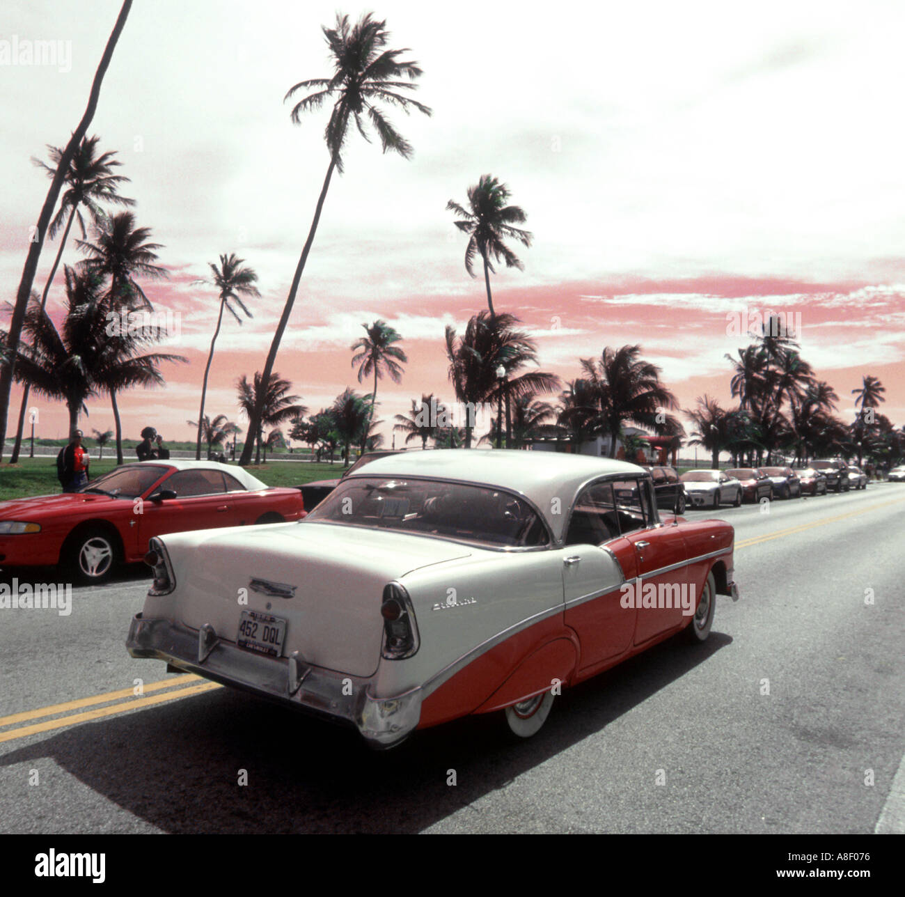 Old Chevrolet driving along the Art Deco Drive in Miami South Beach ...