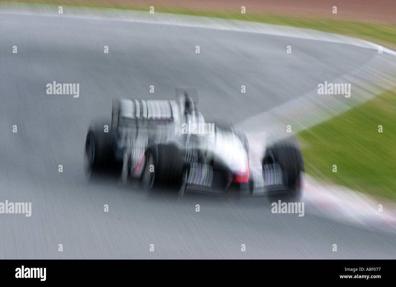 Formula 1 racing car in motion Stock Photo - Alamy