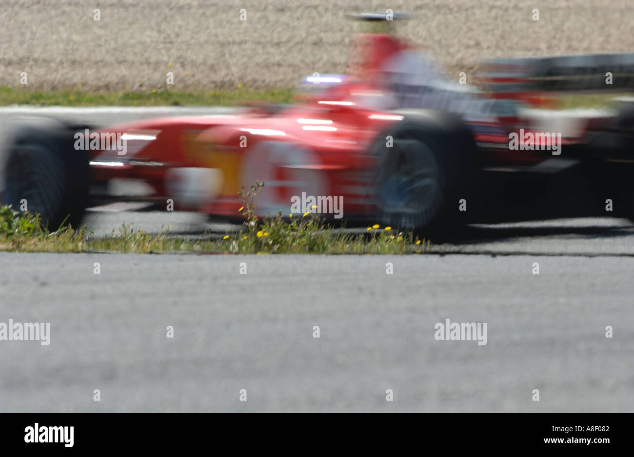 Formula 1 racing car on a course with flowers Stock Photo - Alamy