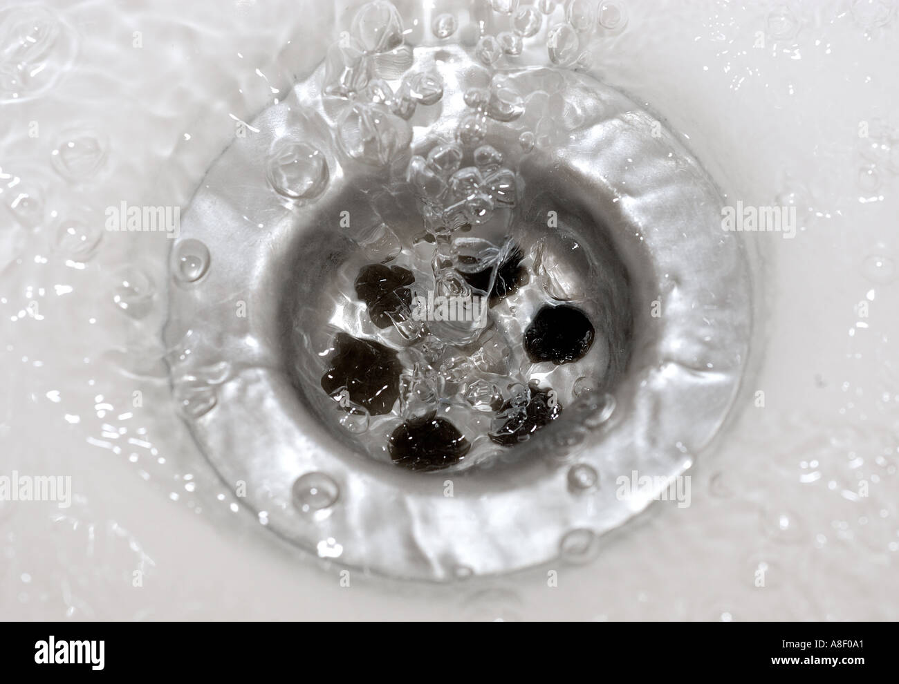 Floating water in a wash basin Stock Photo - Alamy