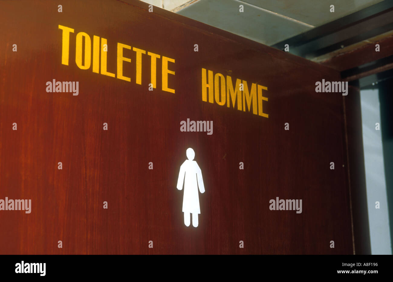 Contradictory signs on a toilet door in the Palais de Congress, Bamako ...