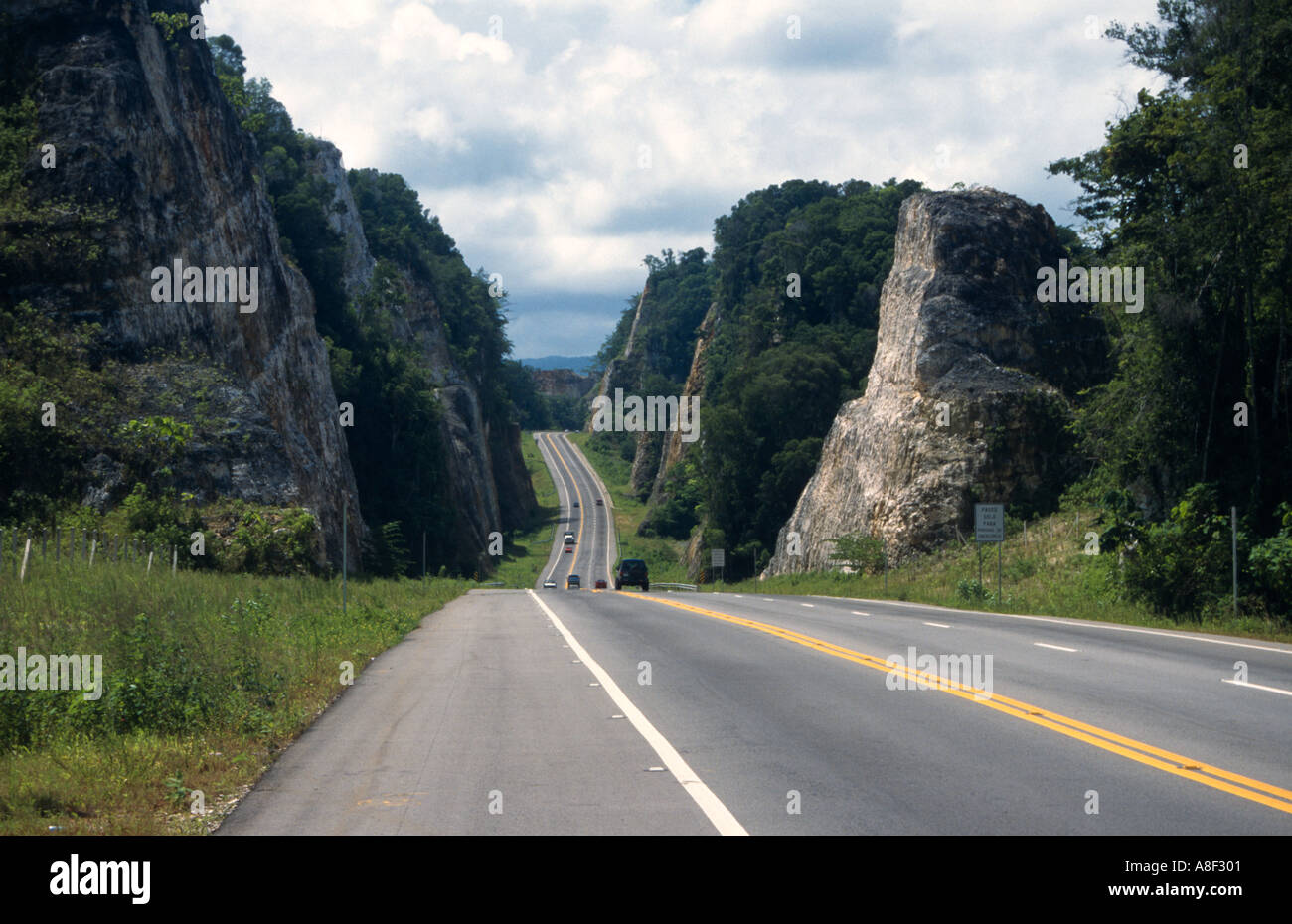 Highway cutting through limestone karst Puerto Rico Stock Photo - Alamy