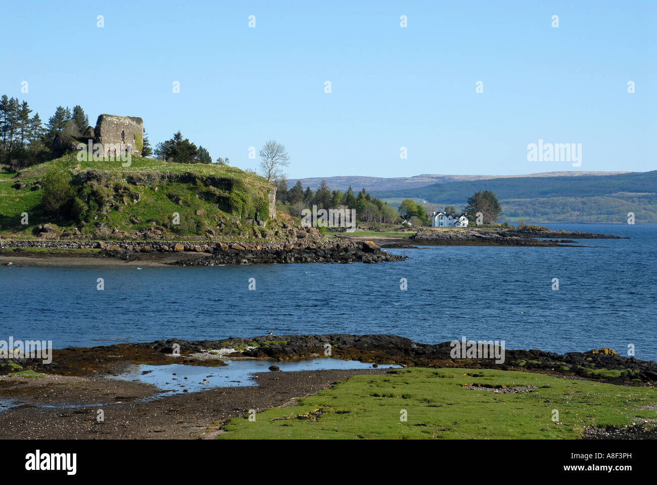 The ruins of 13th century Aros Castle on the Mull coast overlooking the ...