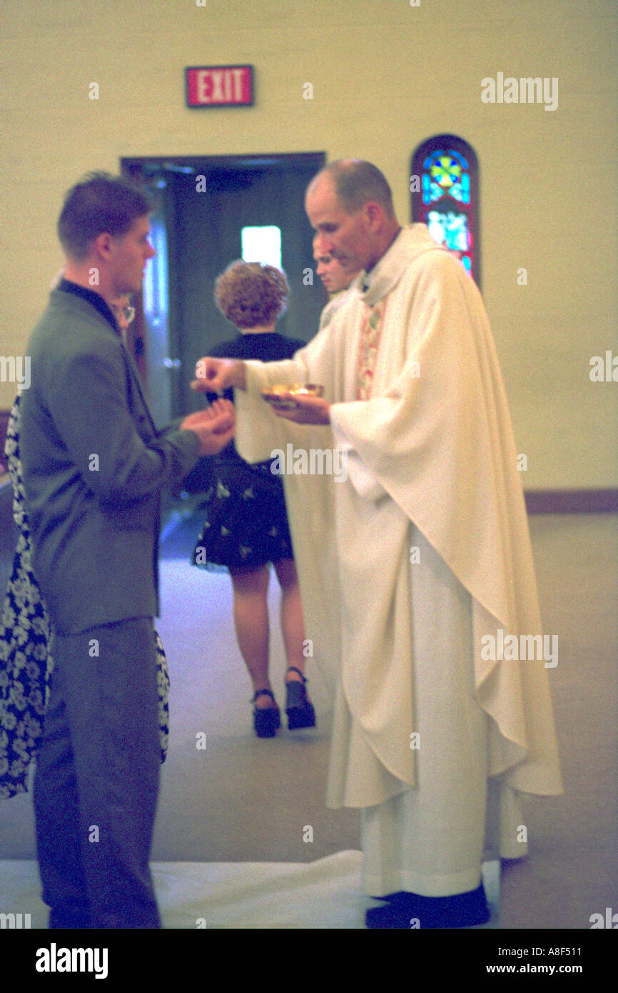 Communion church priest teen hi-res stock photography and images - Alamy