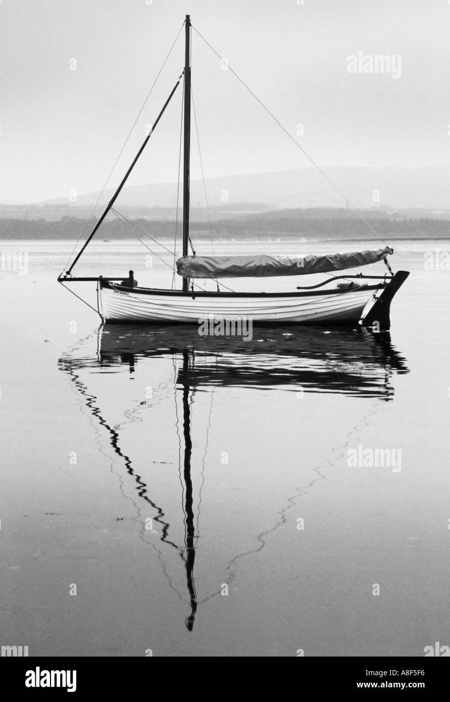 Traditional gaff rig clinker day boat on mooring Stock Photo - Alamy