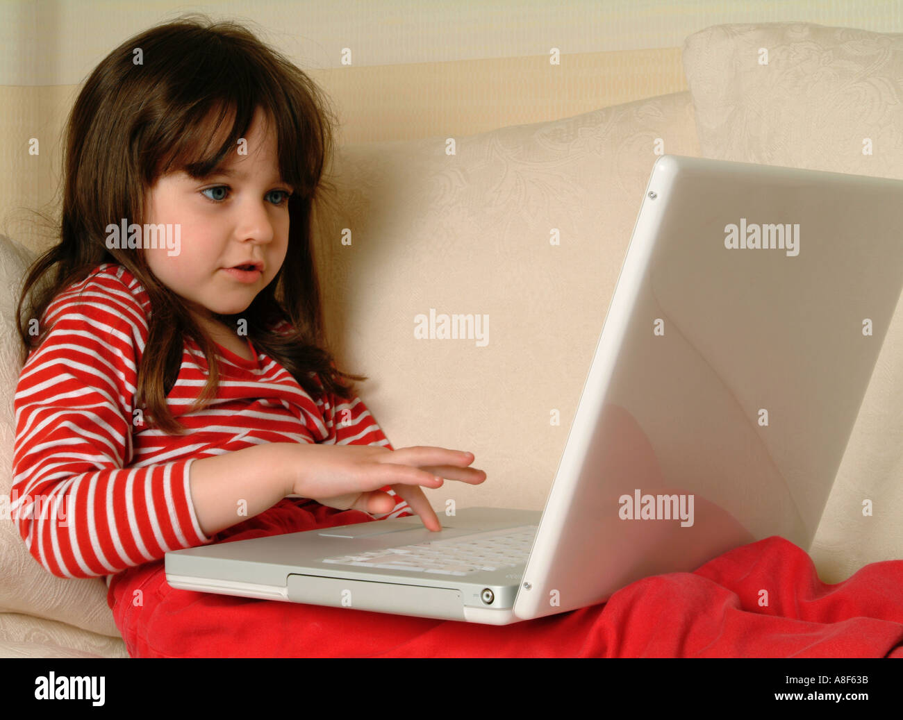 6 year old girl with a laptop computer Stock Photo - Alamy