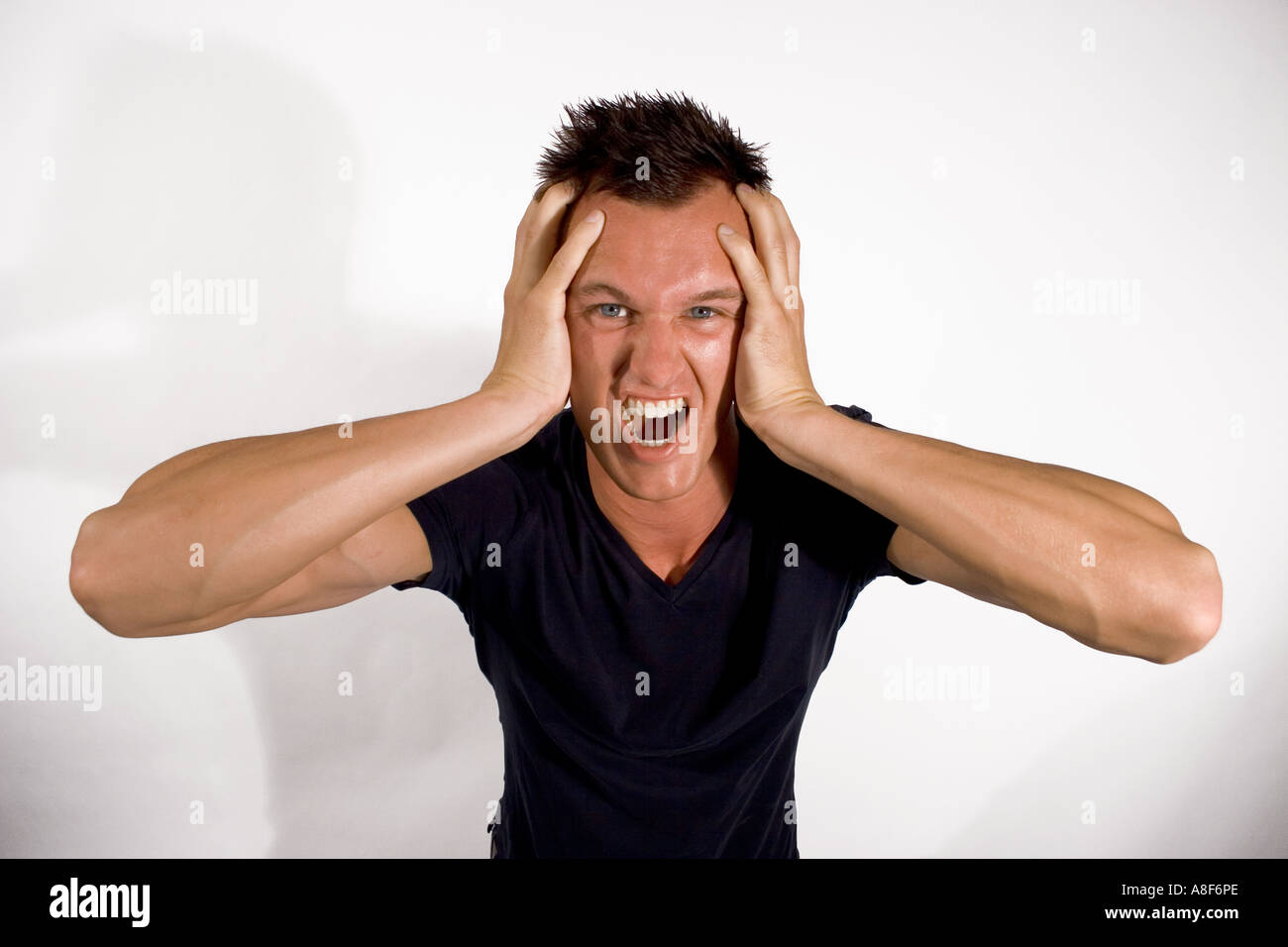 Scream man hold head hi-res stock photography and images - Alamy