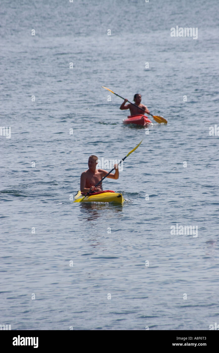 Two kayaking men in the ocean Stock Photo - Alamy
