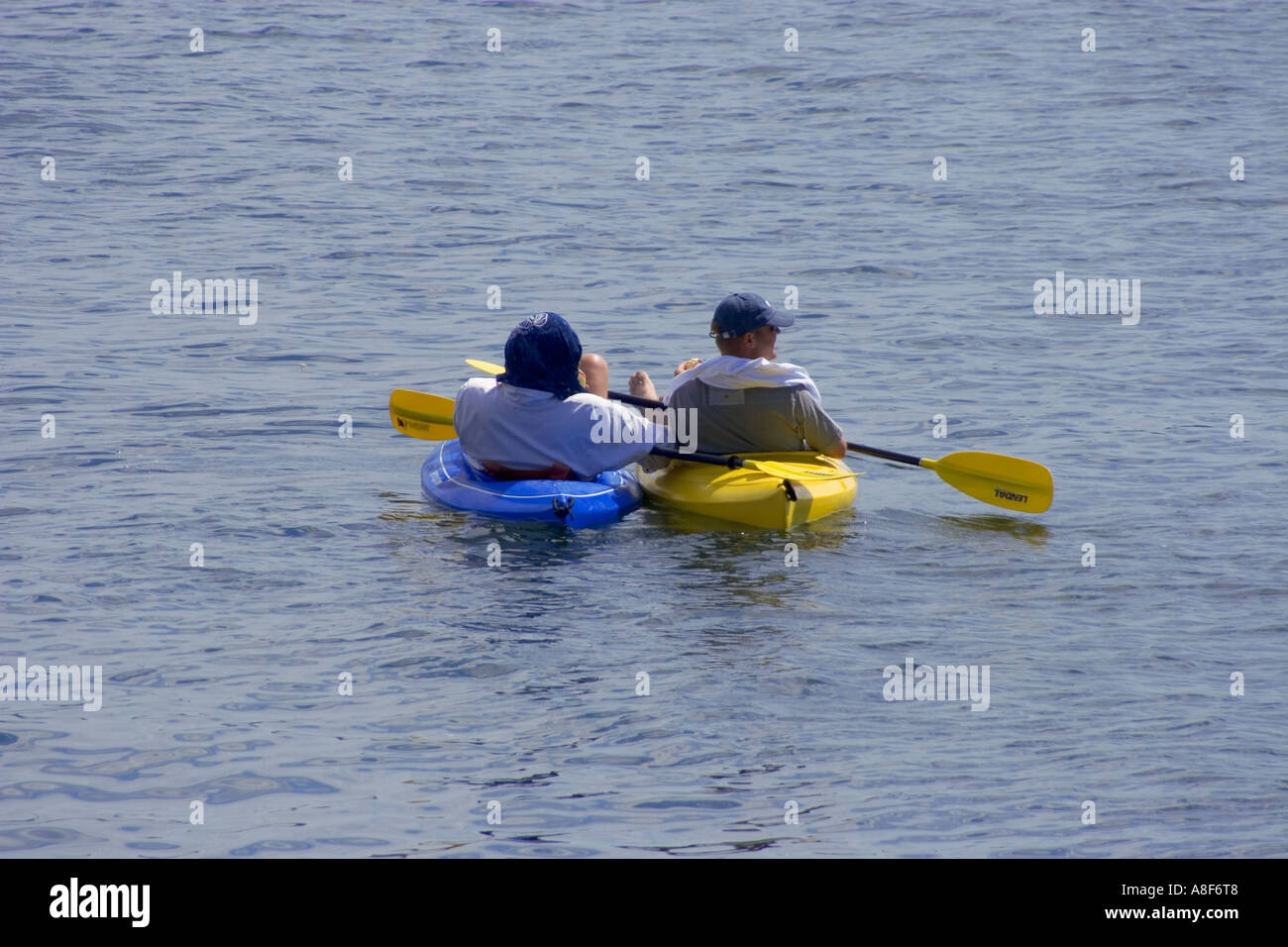 Two people sitting in kayaks Stock Photo - Alamy