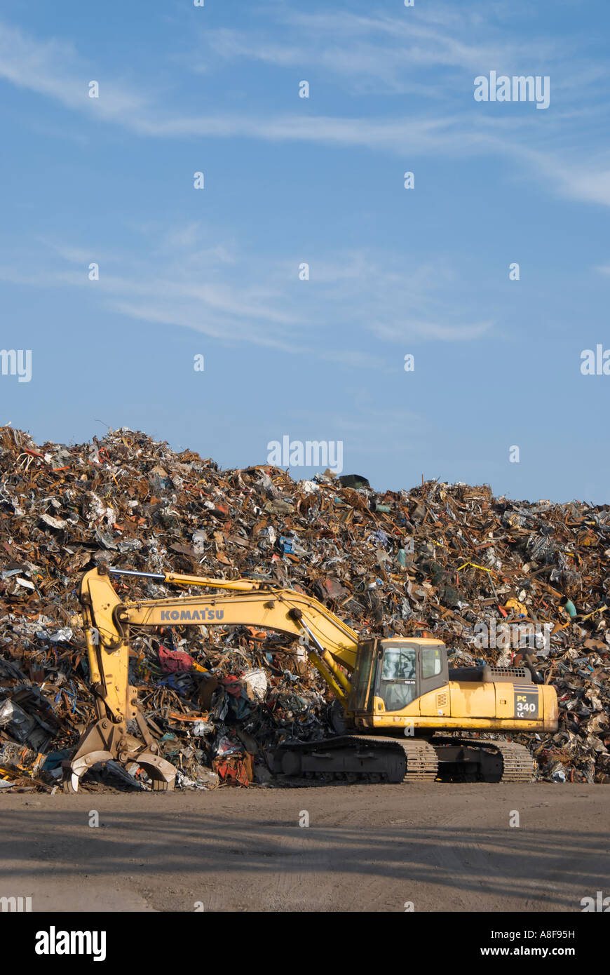 A pile of scrap metal ready for recycling, with dormant machinery in ...