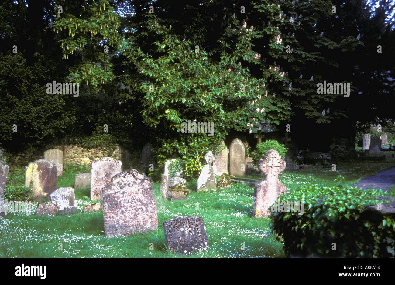 Cemetery in churchyard castle Combe UK Stock Photo - Alamy
