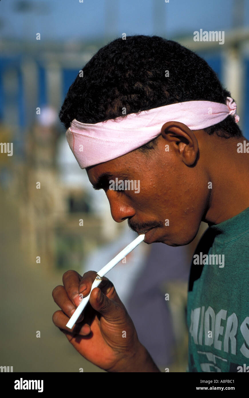 An Egyptian Man Smoking lighting a cigarette Luxor Egypt Stock Photo ...