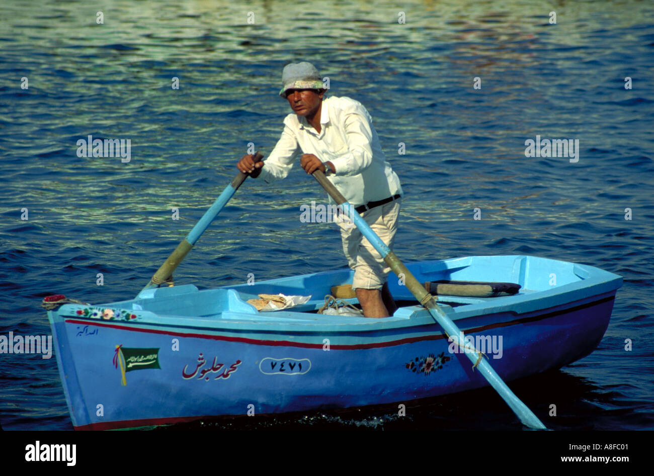 Man in rowboat hi-res stock photography and images - Alamy
