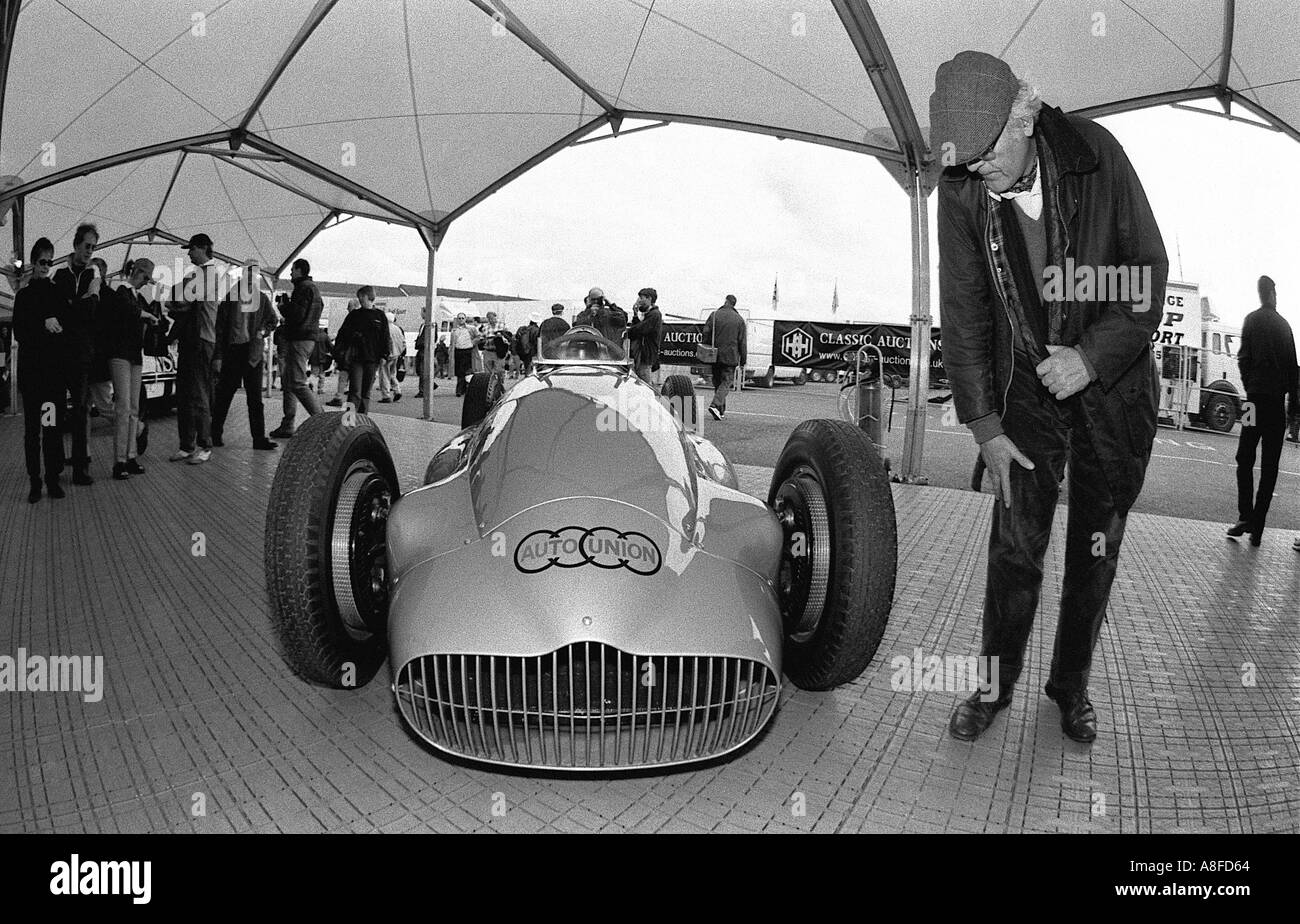 Old man admiring a vintage racing car Stock Photo - Alamy