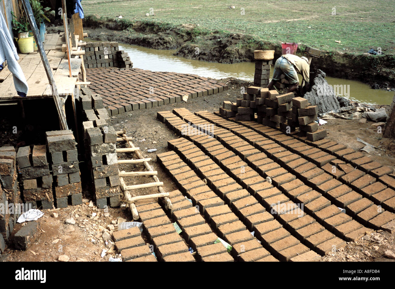 making mud bricks antananarivo madagascar Stock Photo - Alamy