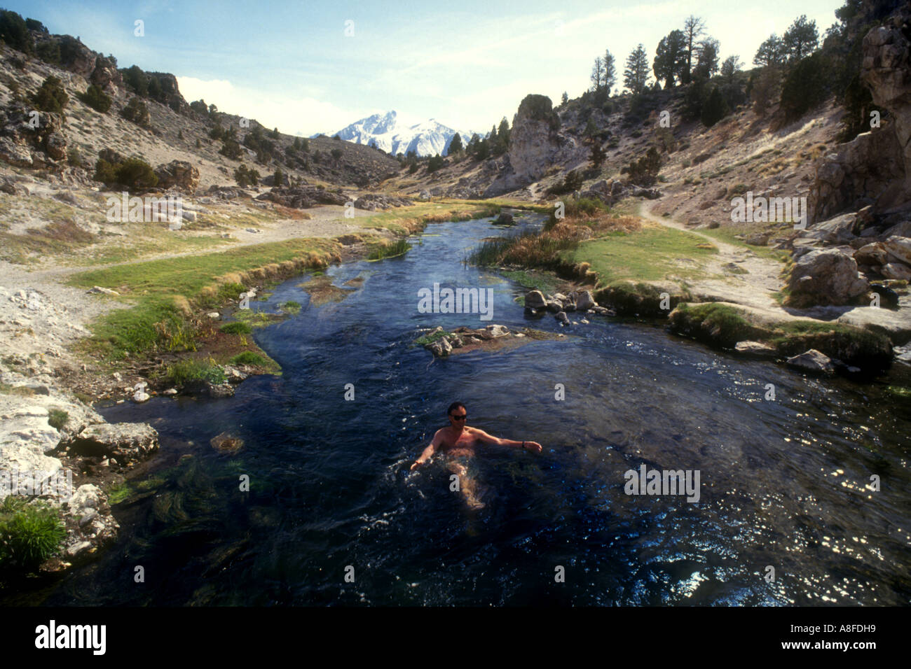 Man enjoys bathing in hot springs at Hot Creek, CA.USA Stock Photo - Alamy