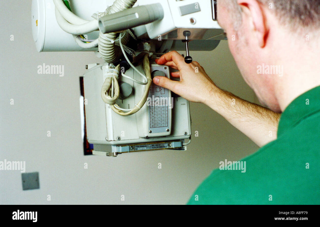 Radiographer positioning x ray equipment Stock Photo - Alamy
