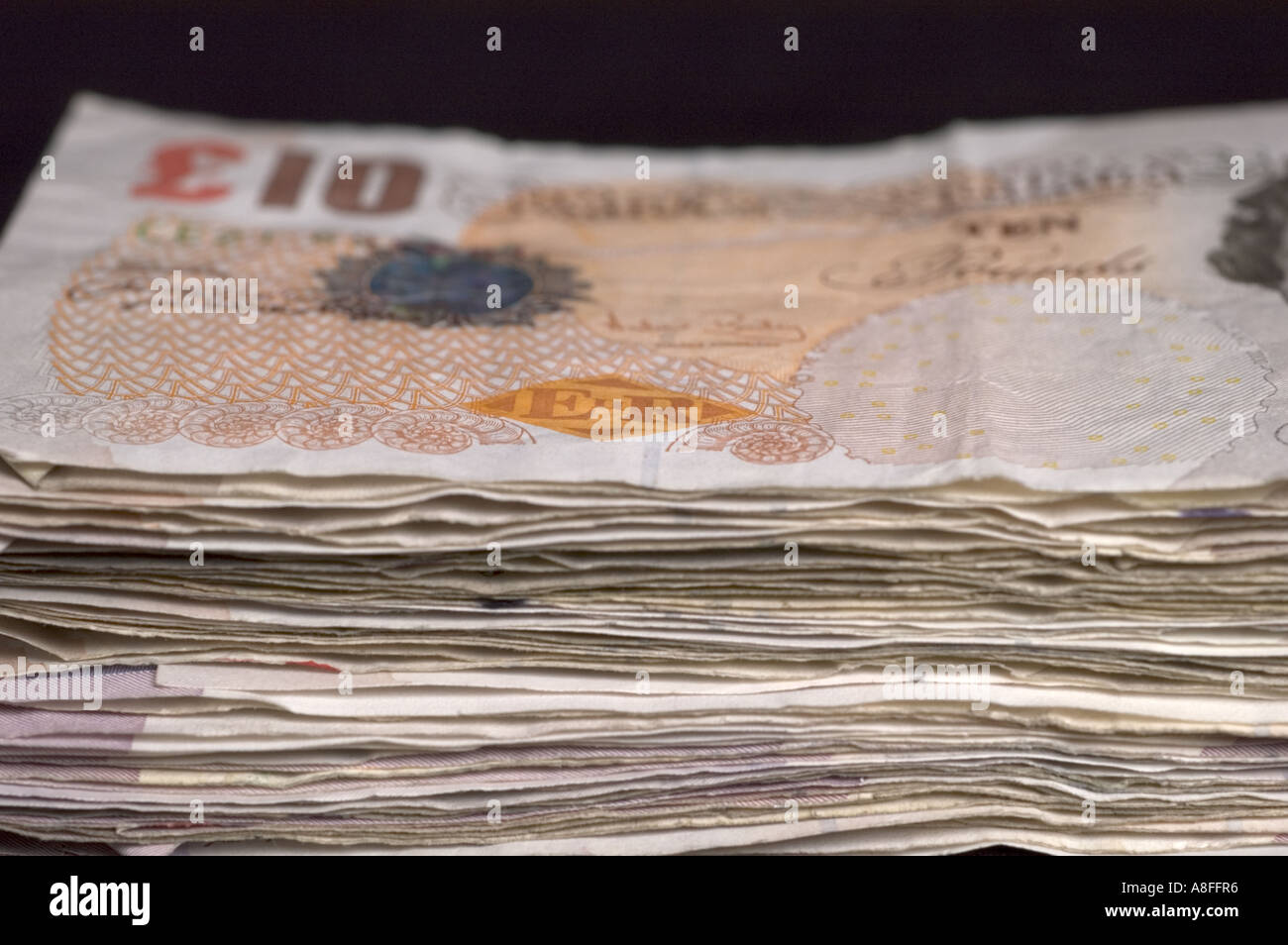10 pound notes pile hi-res stock photography and images - Alamy