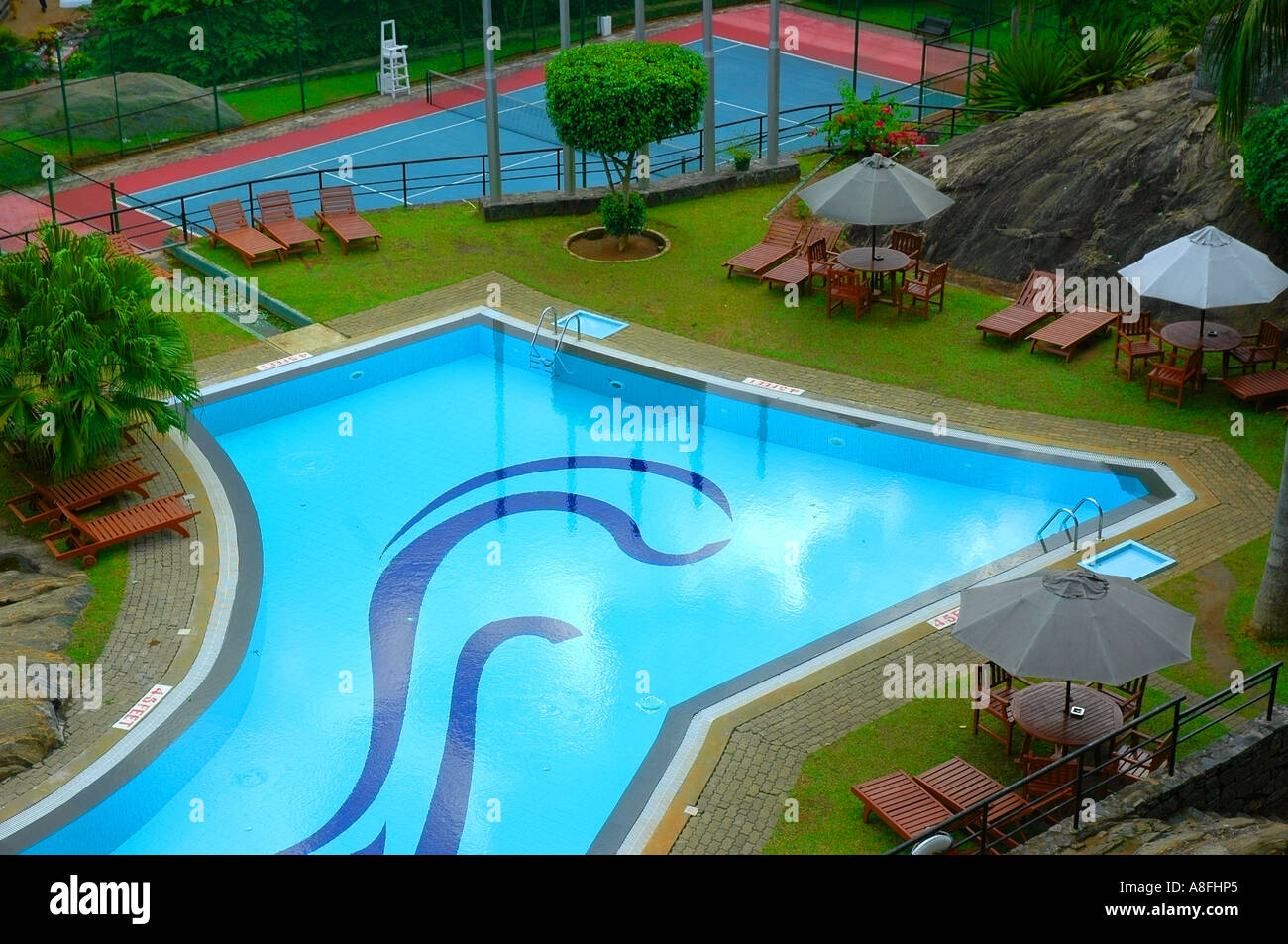 Outdoor Swimming Pool and Tennis Court Stock Photo - Alamy