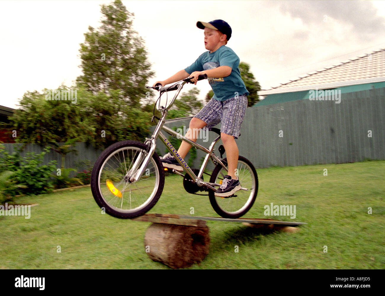 A BOY RIDING HIS BIKE BAPN 338 Stock Photo - Alamy