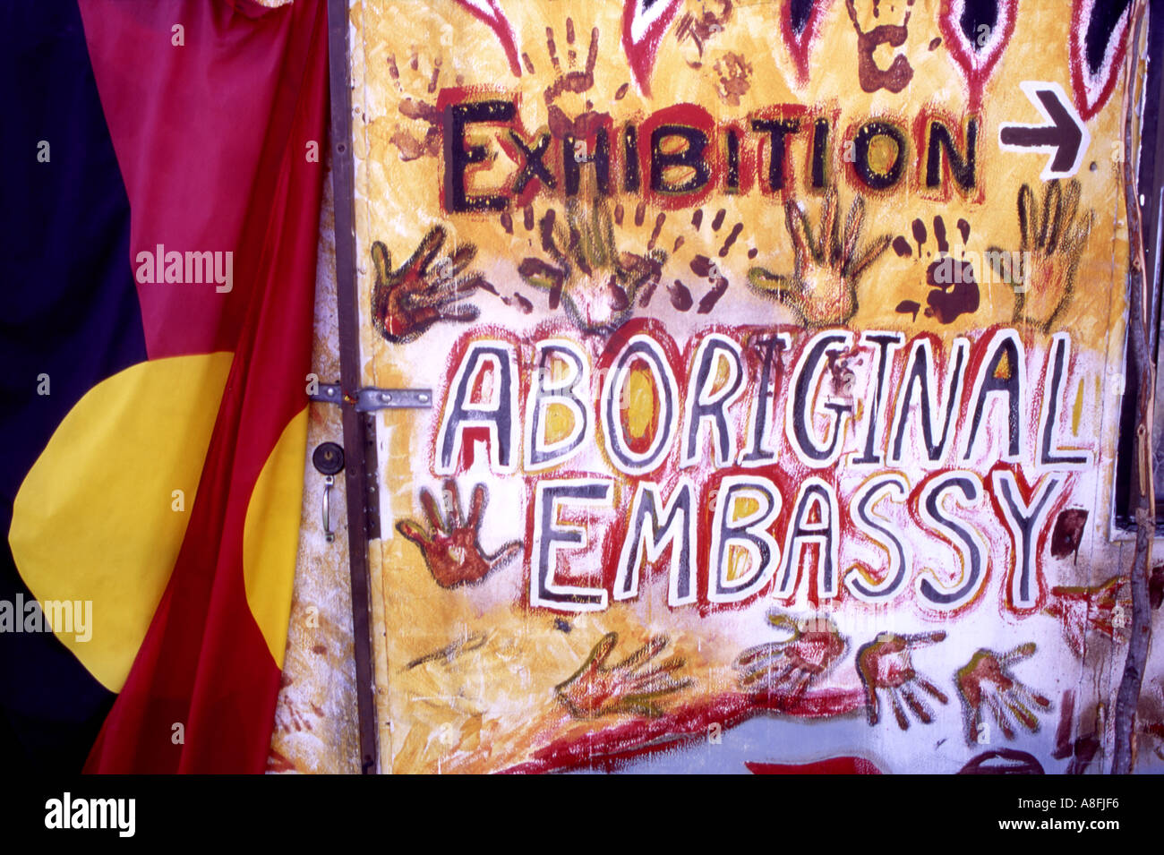 Protest sign with Aboriginal flag outside the makeshift Aboriginal ...