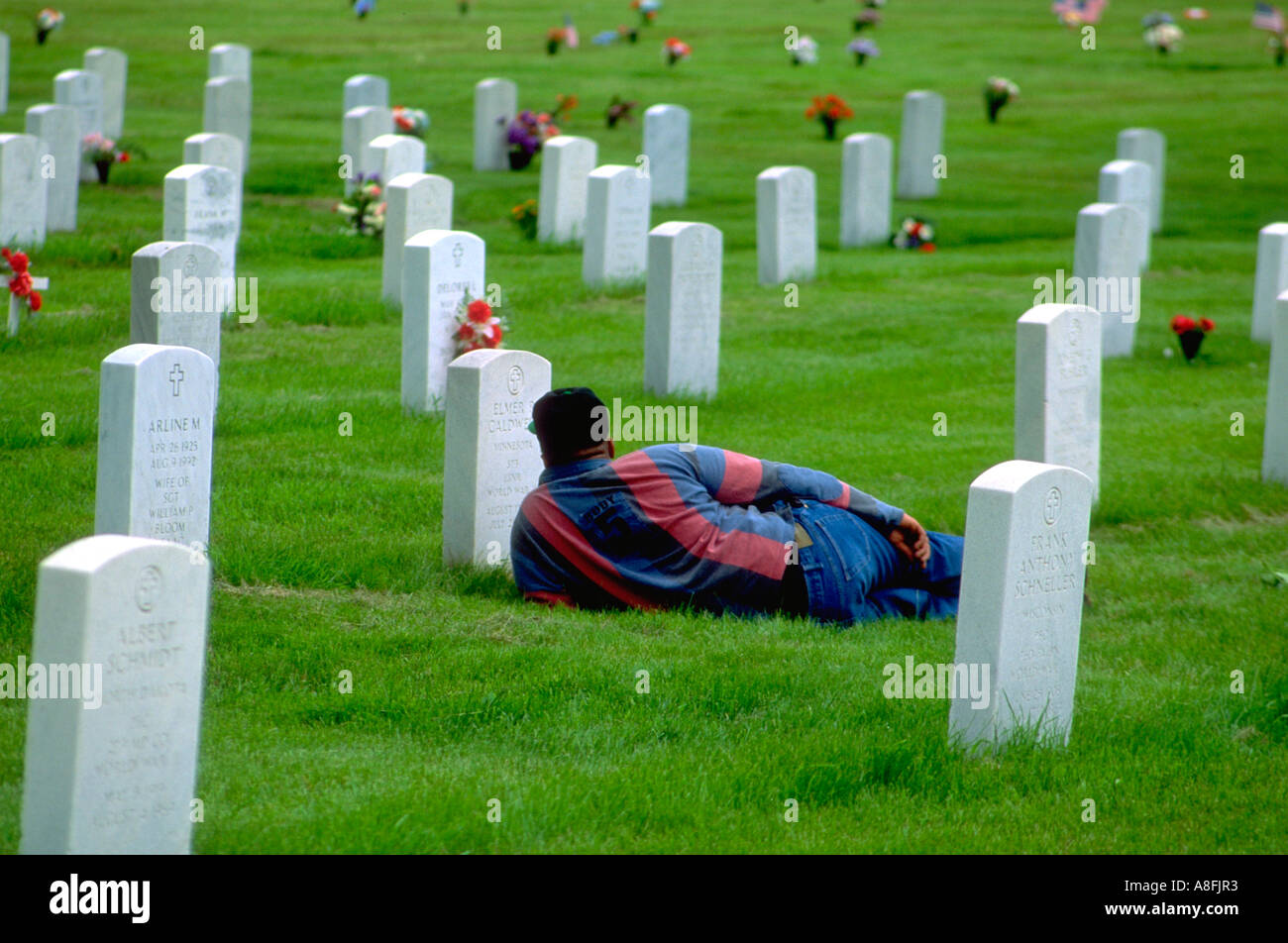 Black man grieving at Fort Snelling Military Cemetery on Memorial Day ...