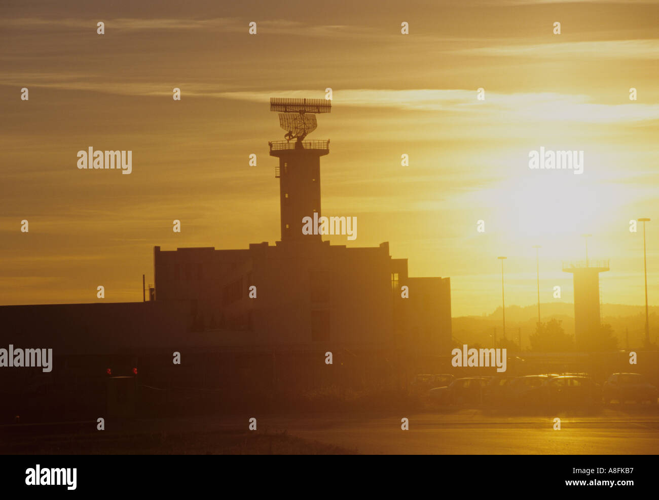 control tower with radar antenna at sunset Stock Photo - Alamy