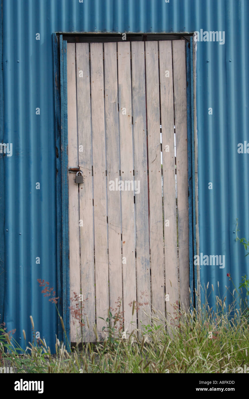 OLD BLUE BUILDING WITH A WHITE DOOR BAPD1196 Stock Photo - Alamy