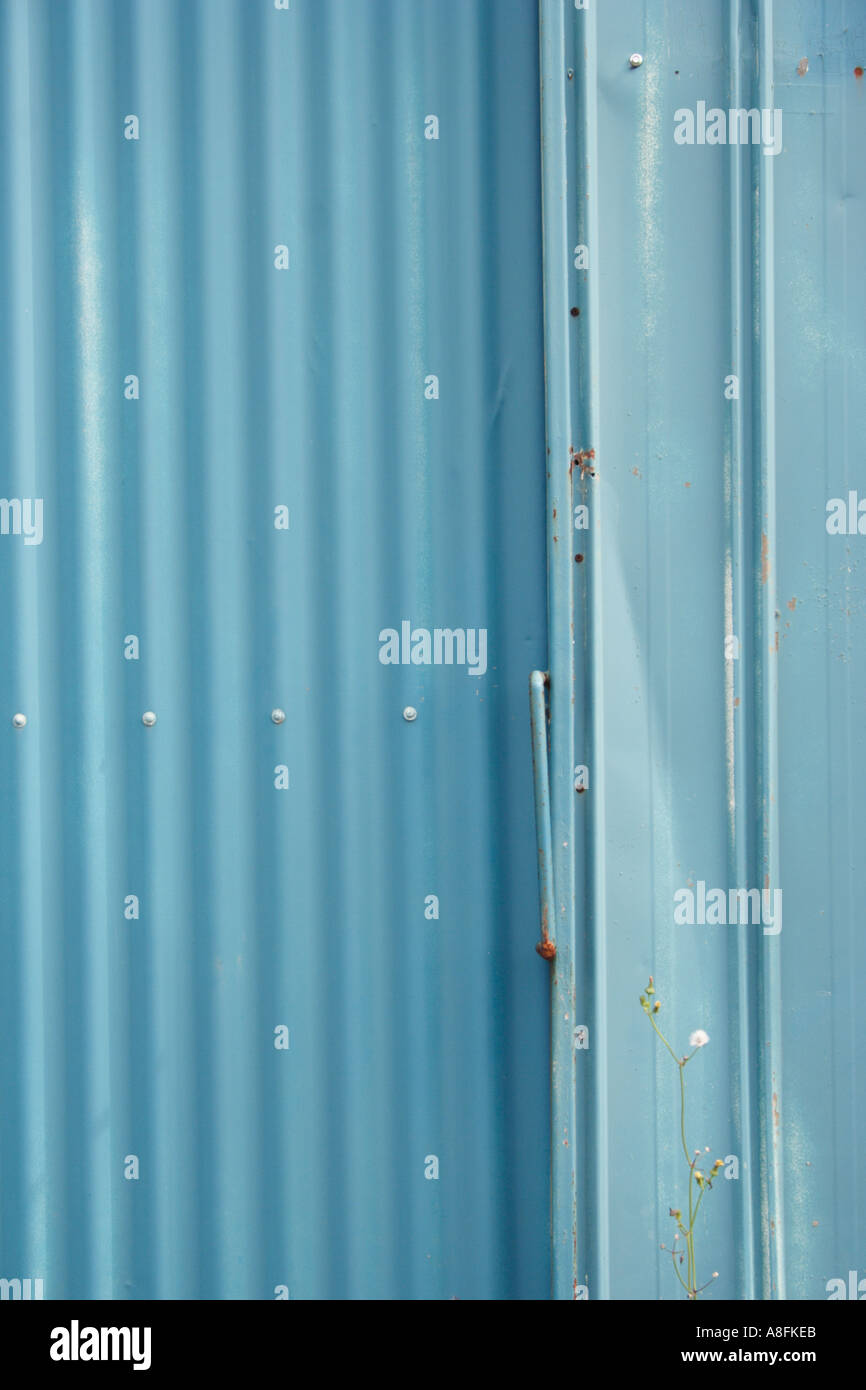 OLD BLUE BUILDING WITH A WHITE DOOR BAPD1200 Stock Photo - Alamy