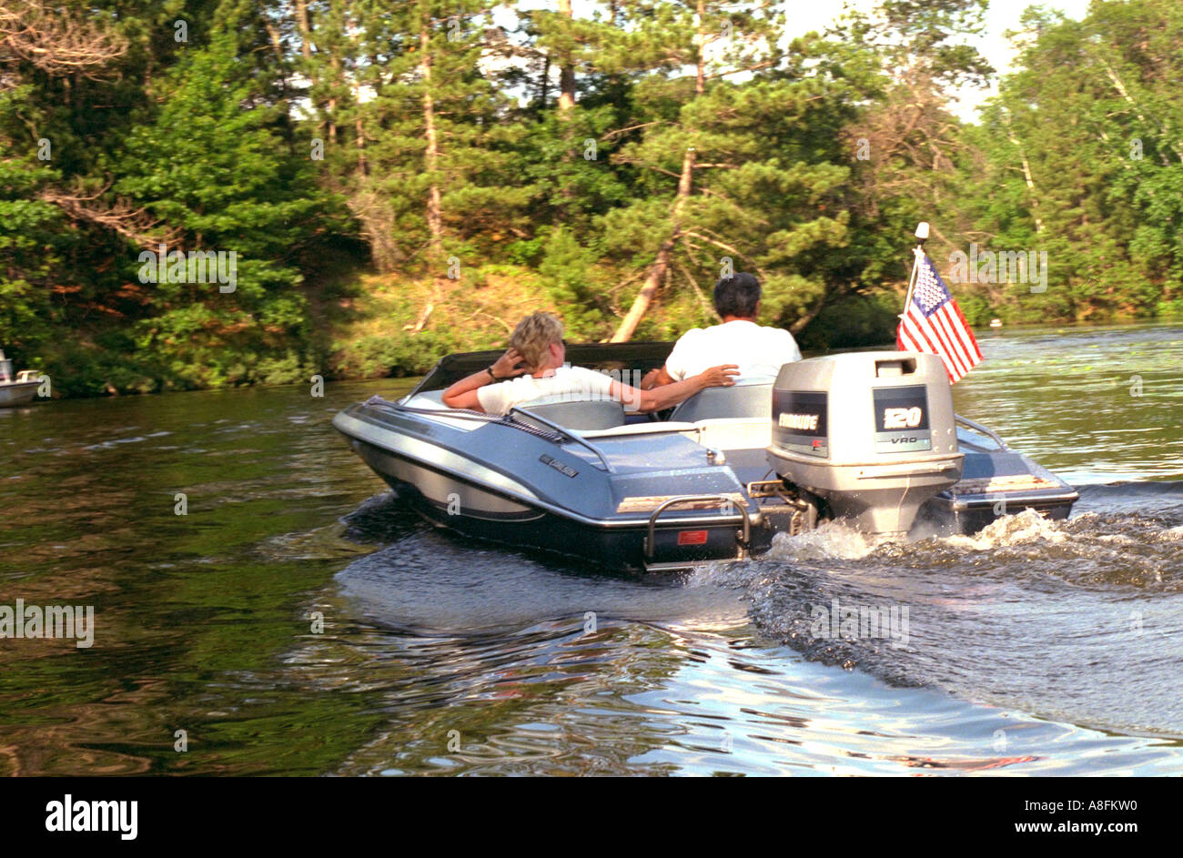 Couple motorboating hi-res stock photography and images - Alamy