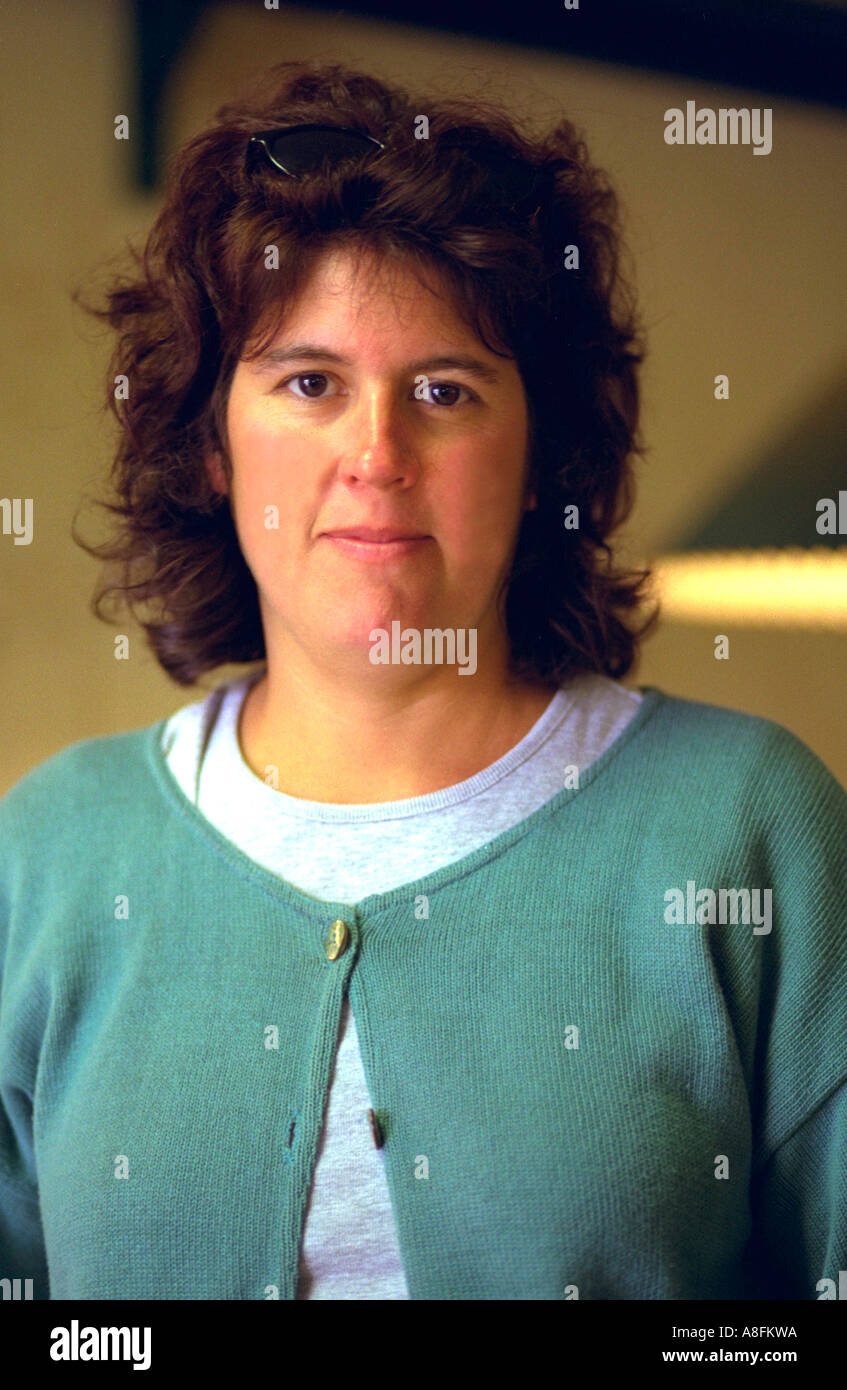 Woman age 32 waiting for lunch in restaurant after leaving summer cabin ...