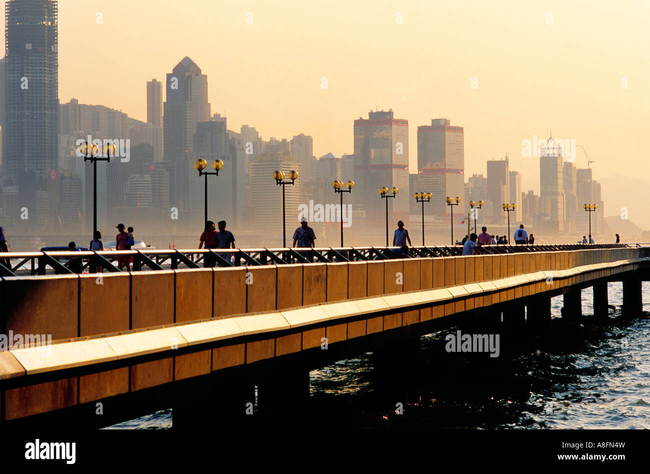 China Hong Kong Victoria harbour with Avenue of Stars promenade at dusk ...