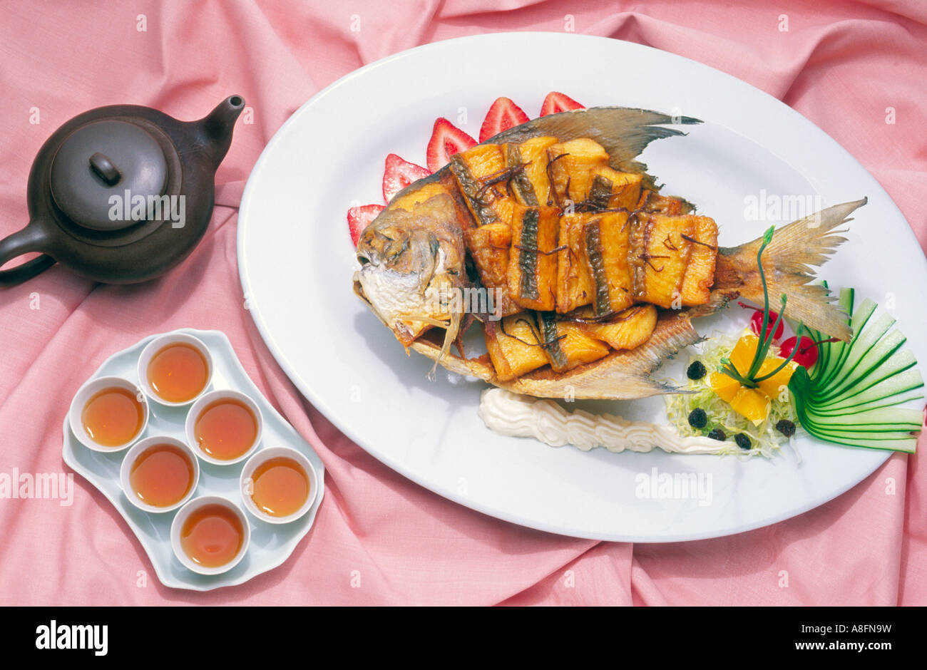 Deep fried fish with Chinese kungfu tea strong tea China Stock Photo ...