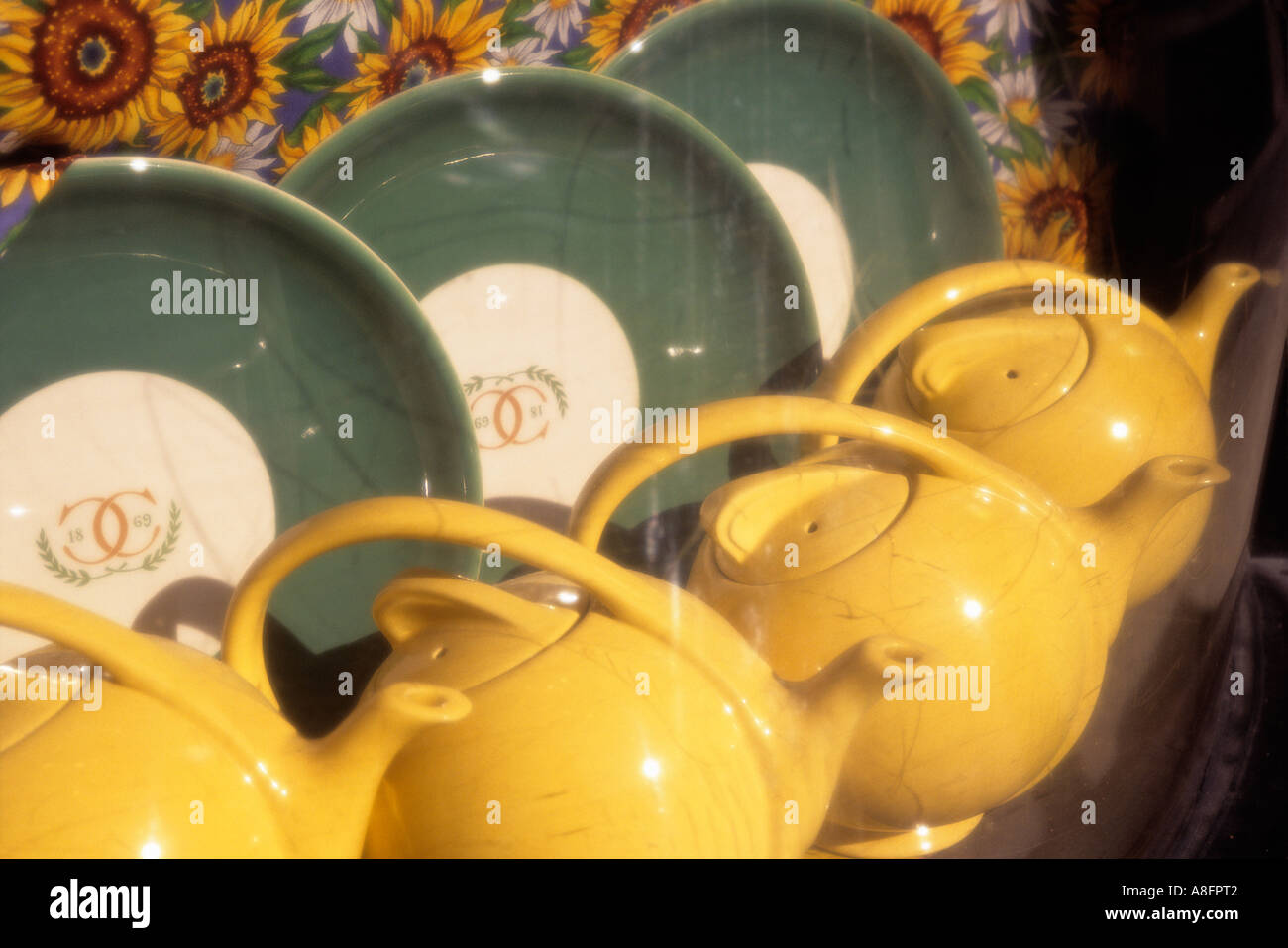 Ceramic pitchers & plates in window display Stock Photo - Alamy