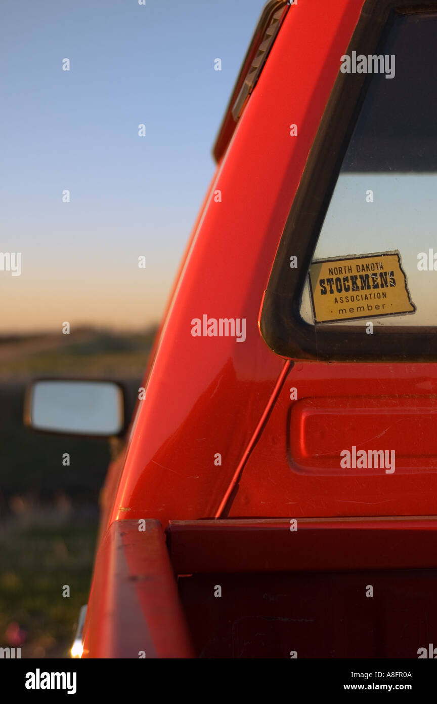 Red Pickup truck by field Stock Photo - Alamy