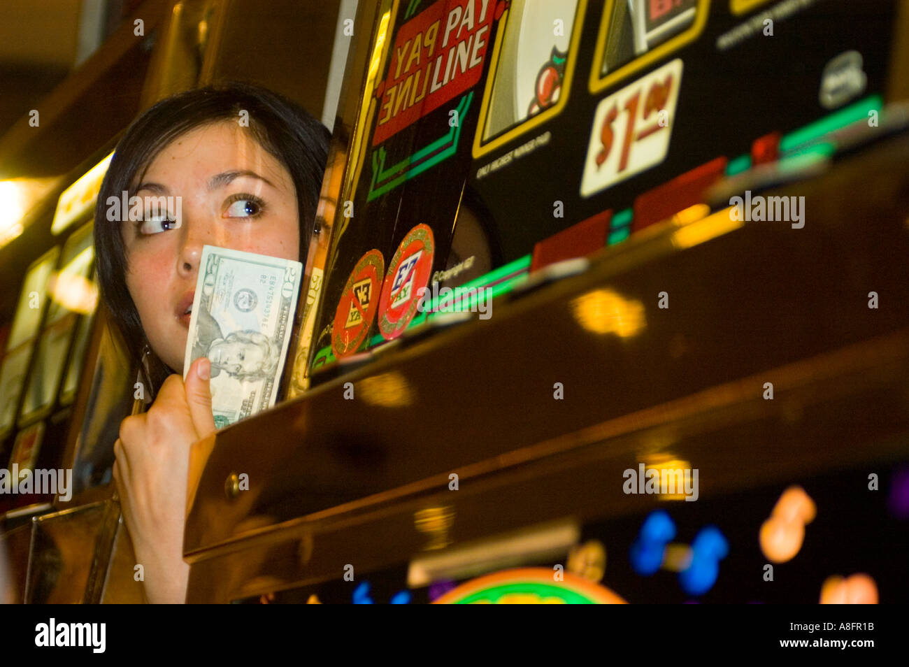 Money in the slot hi-res stock photography and images - Alamy