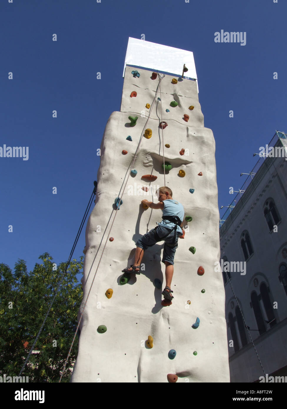 Boy learn rock climbing Stock Photo - Alamy