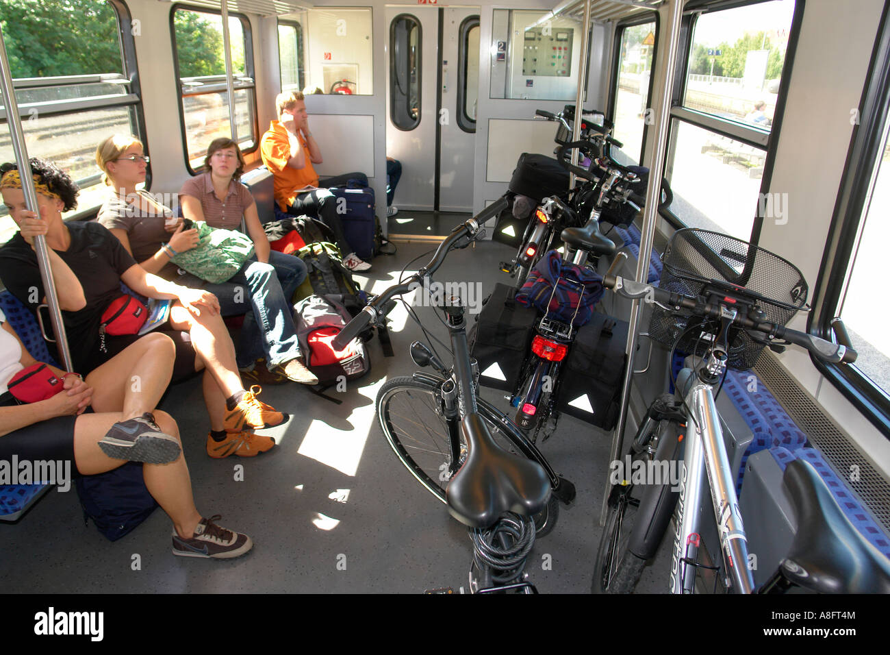 Bikers group sit in train with their bikes Bavaria Germany Stock Photo ...