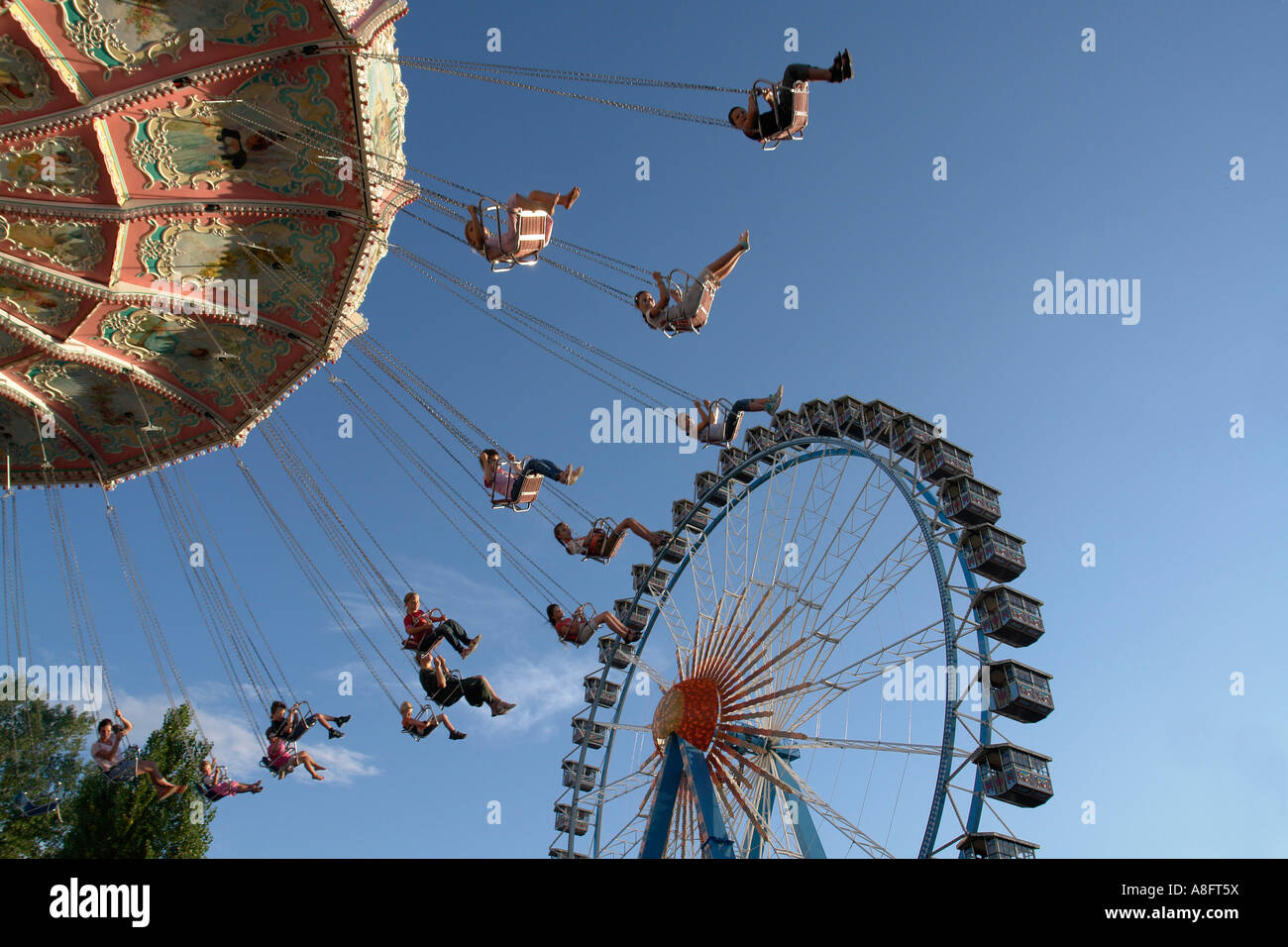 Roundabout carousel and roller coaster at Gaubodenfest Straubing ...