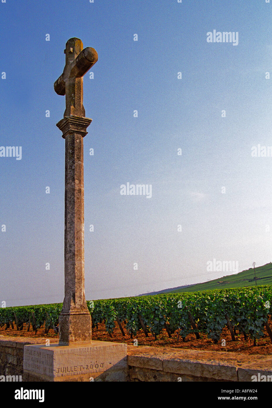 The famous stone cross marking the Grand Cru vineyards Romanee Conti ...