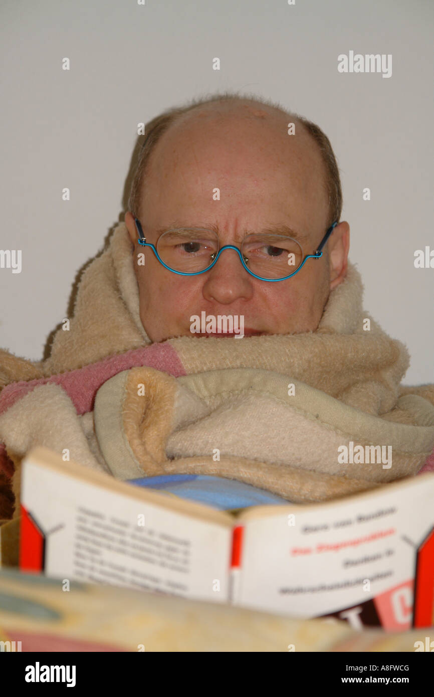 Man sick reading in bed Stock Photo - Alamy