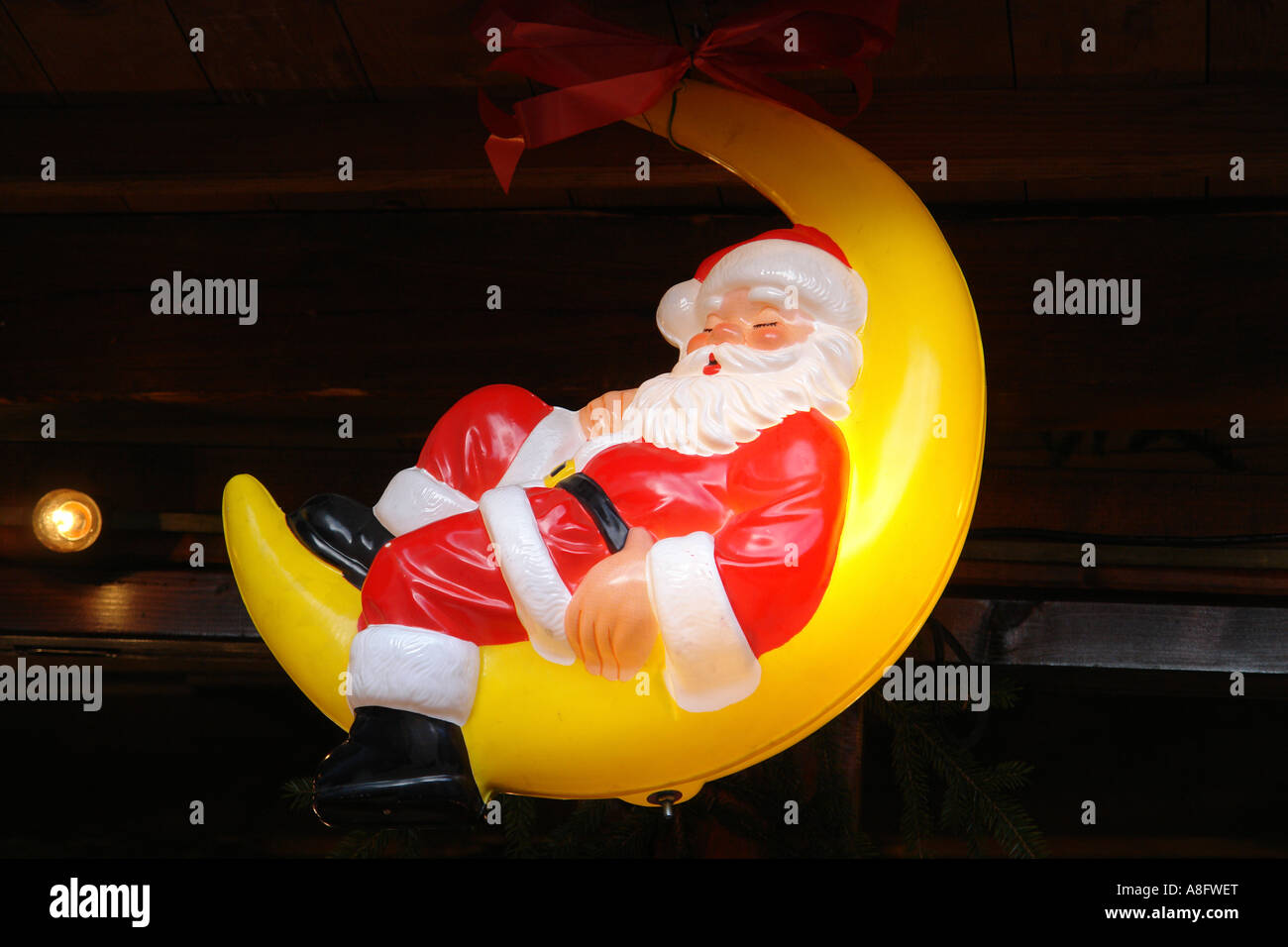 Santa Claus sitting on half moon Stock Photo - Alamy