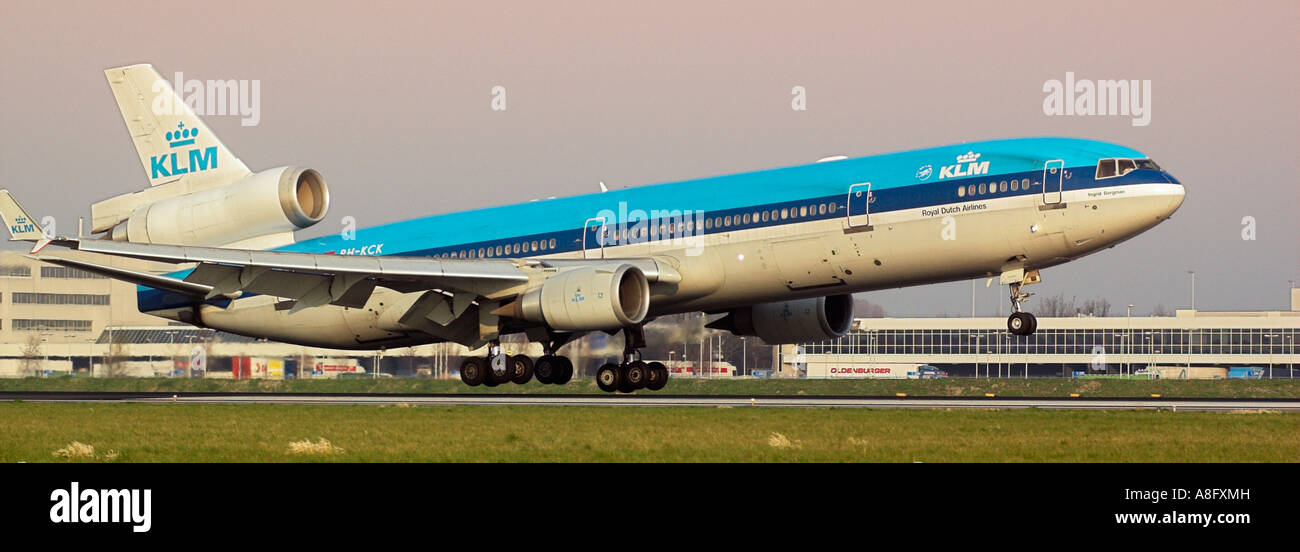 A KLM Boeing MD11 landing at dawn at Schipol airport Amsterdam Stock ...